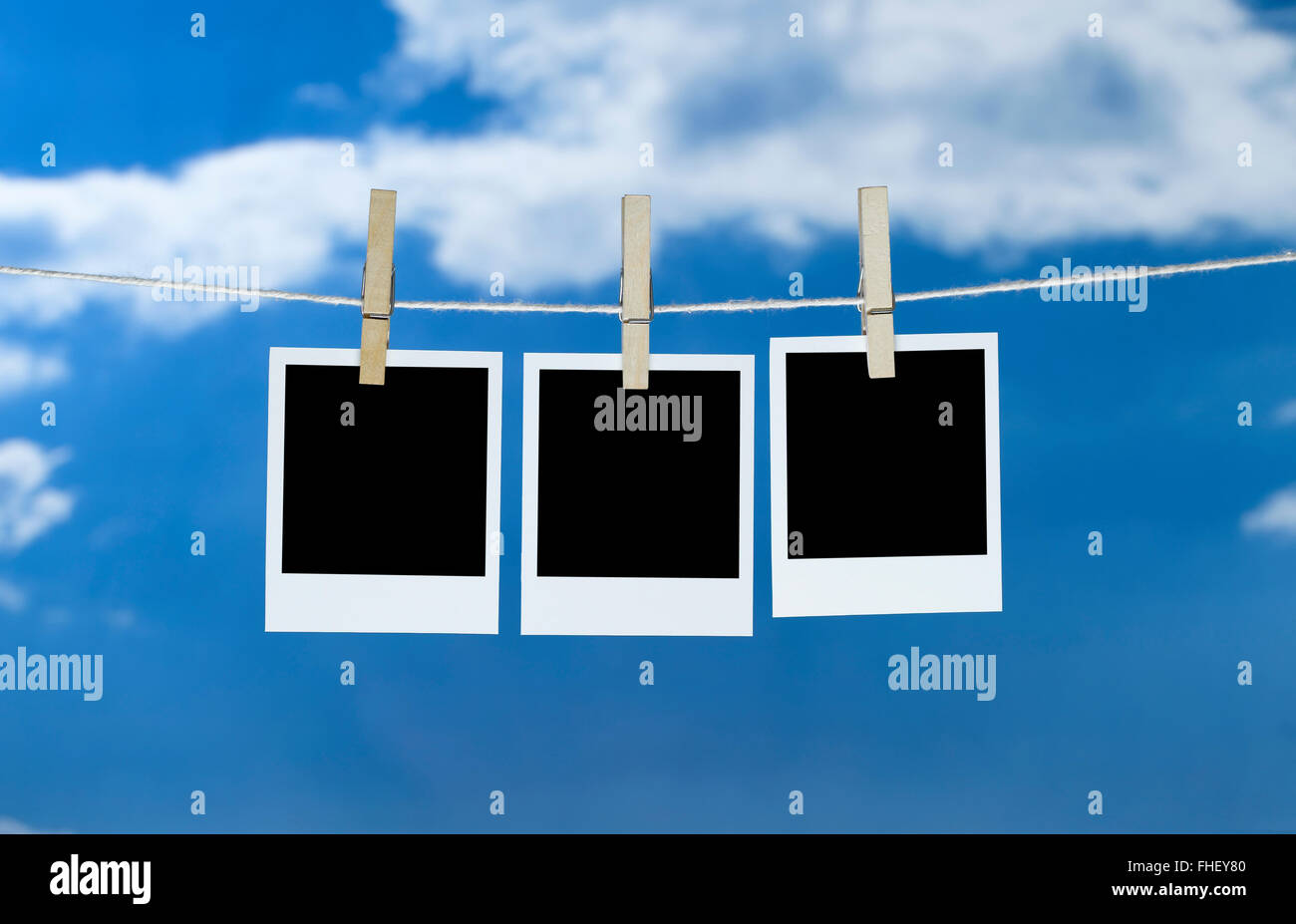 Washing Line with hanging blank polariod paper Stock Photo - Alamy