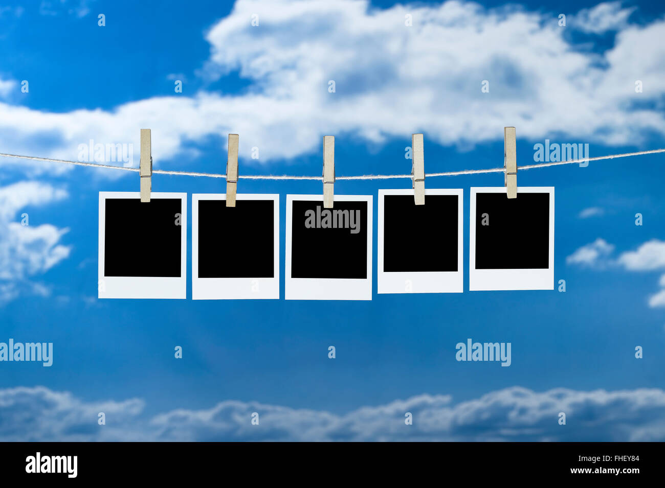 Washing Line with hanging blank Polariod paper Stock Photo - Alamy