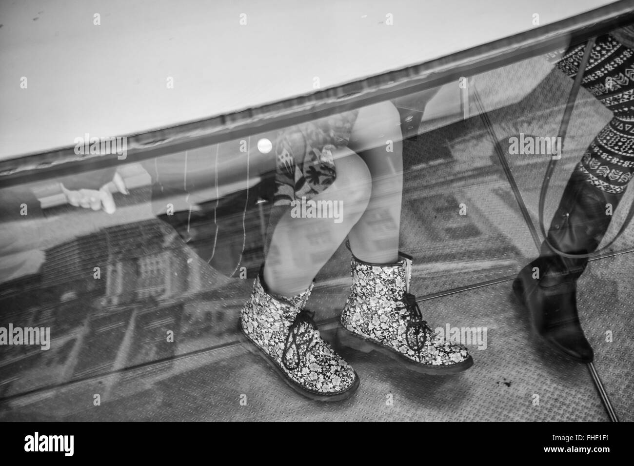 View through glass to peoples feet Stock Photo - Alamy