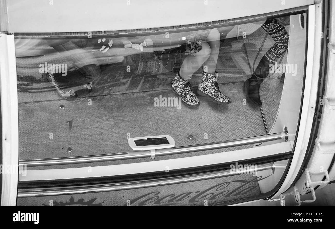 View through glass to peoples feet Stock Photo - Alamy