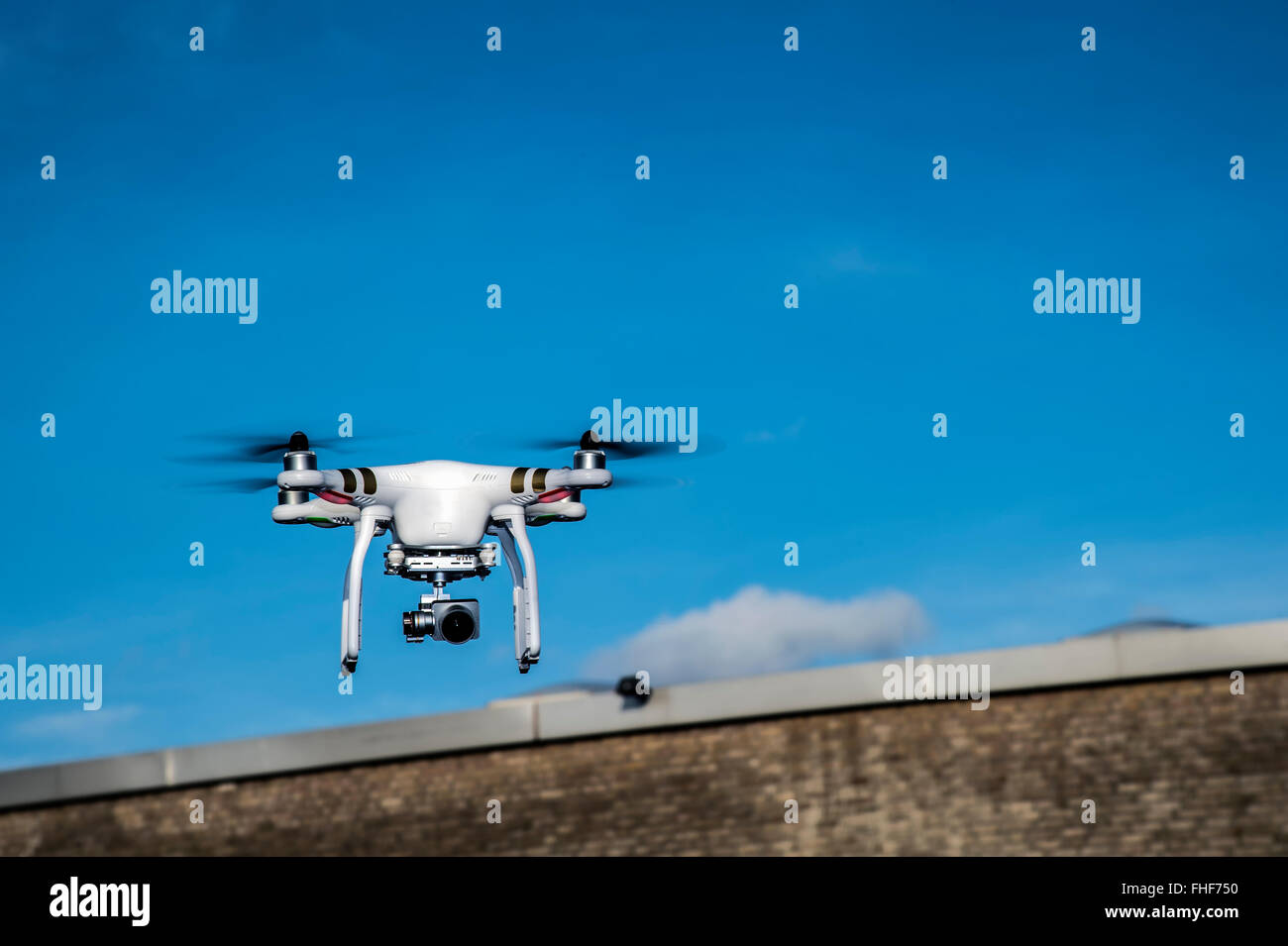 Flying drone with camera Stock Photo - Alamy