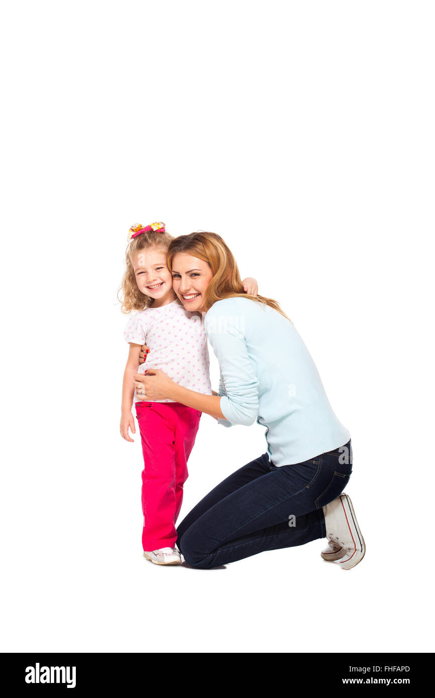 young mother hugging her little daughter isolated on white Stock Photo - Alamy