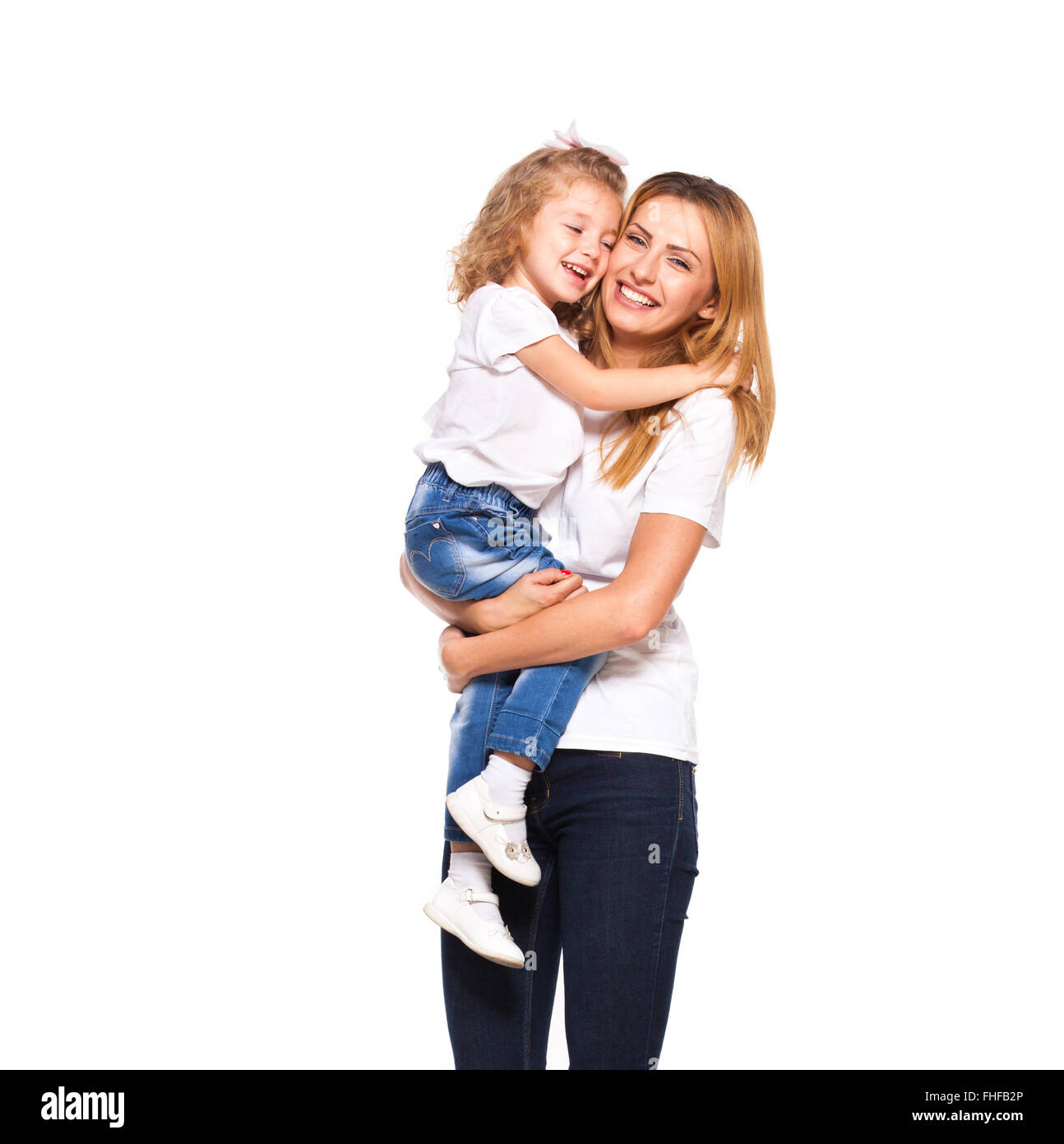 young mother hugging her little daughter isolated on white Stock Photo - Alamy
