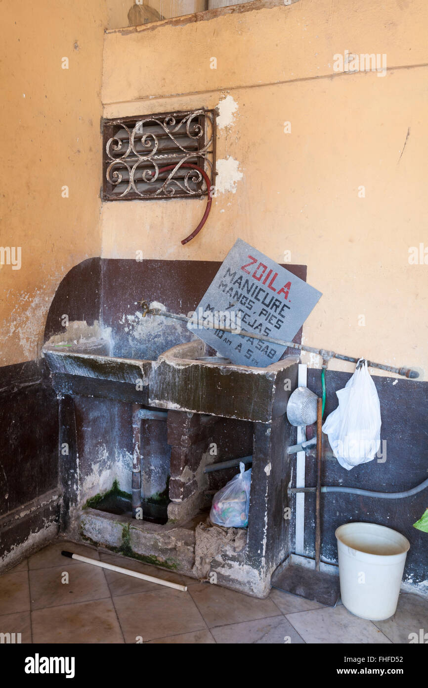 Manicure sign and old sink inside building at Havana, Cuba, West Indies ...