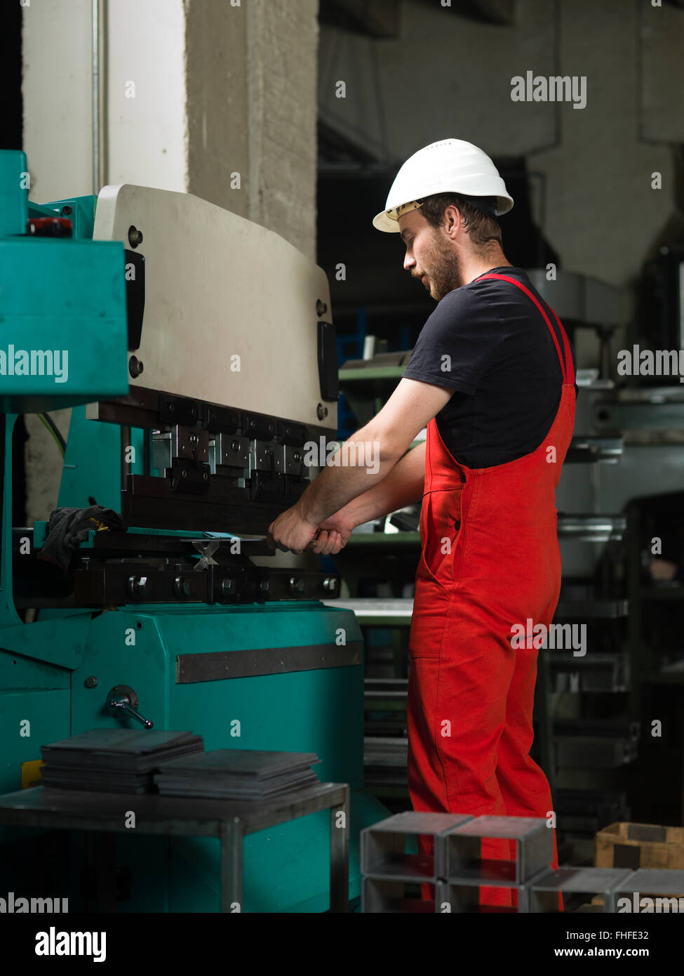 Man wearing blue overalls hi-res stock photography and images - Alamy