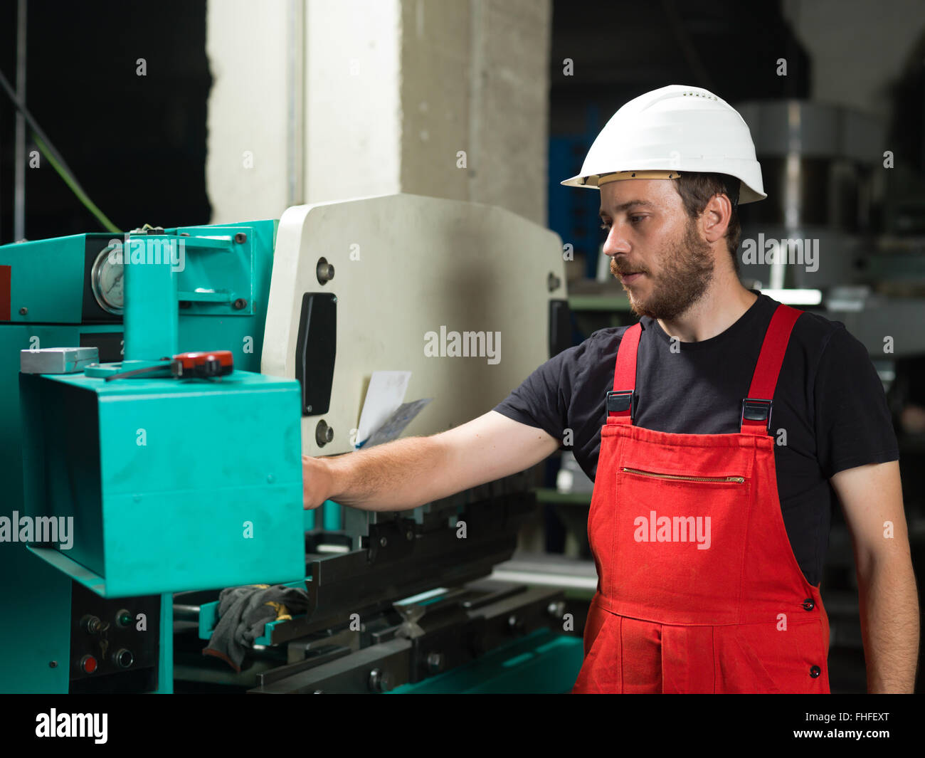 Man wearing blue overalls hi-res stock photography and images - Alamy