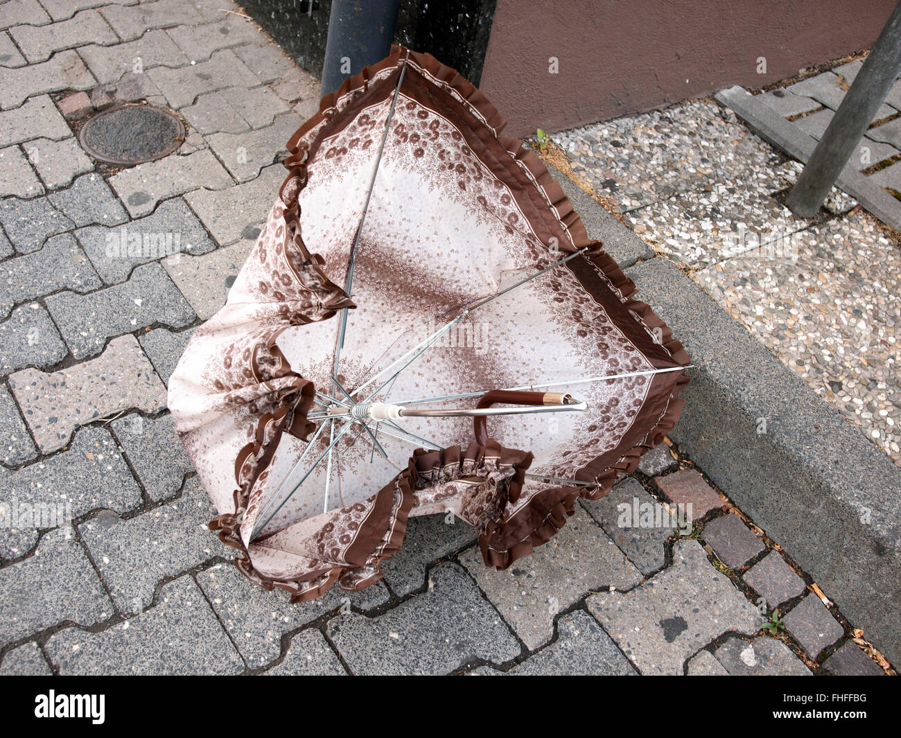 Broken umbrella hi-res stock photography and images - Alamy