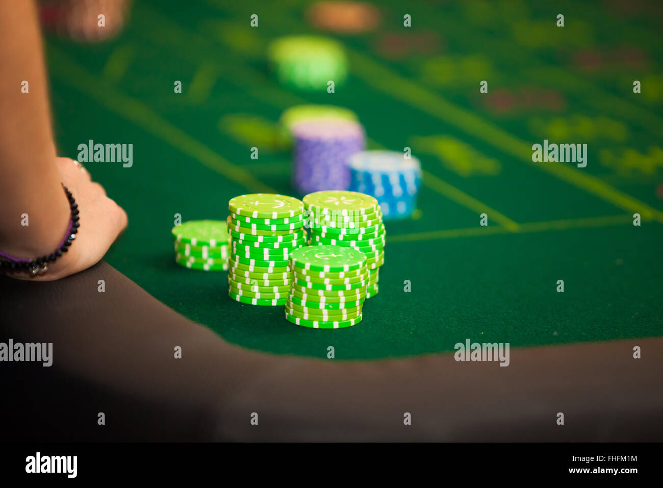 green roulette table with collored chips ready to play Stock Photo - Alamy