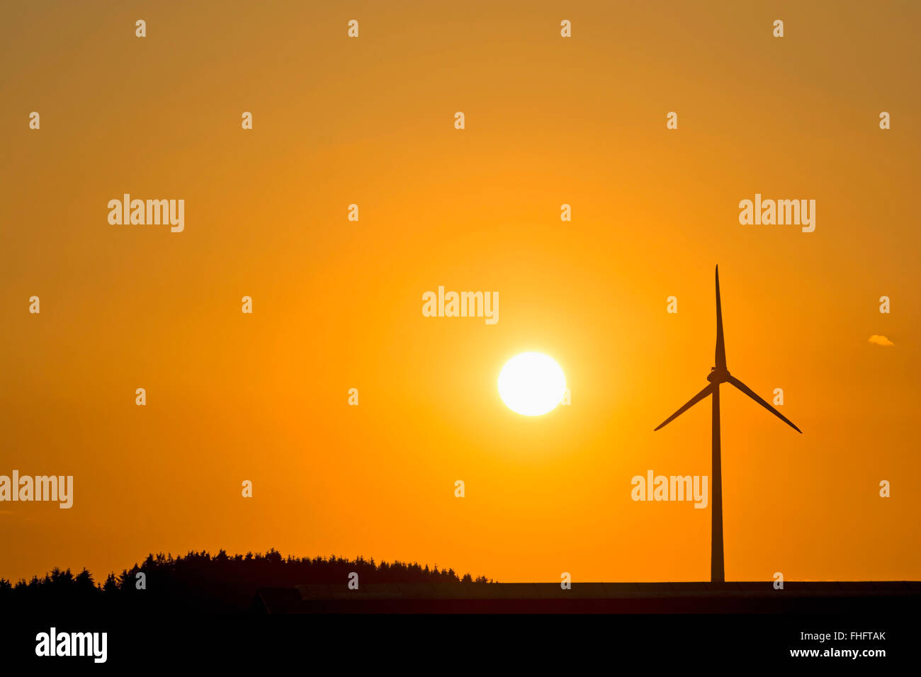Wind wheel and evening sun Stock Photo - Alamy