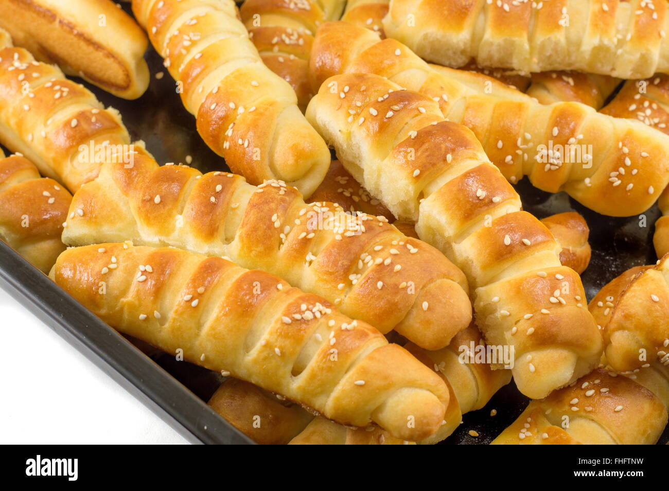 bunch of sesame pastry in a black pan Stock Photo - Alamy