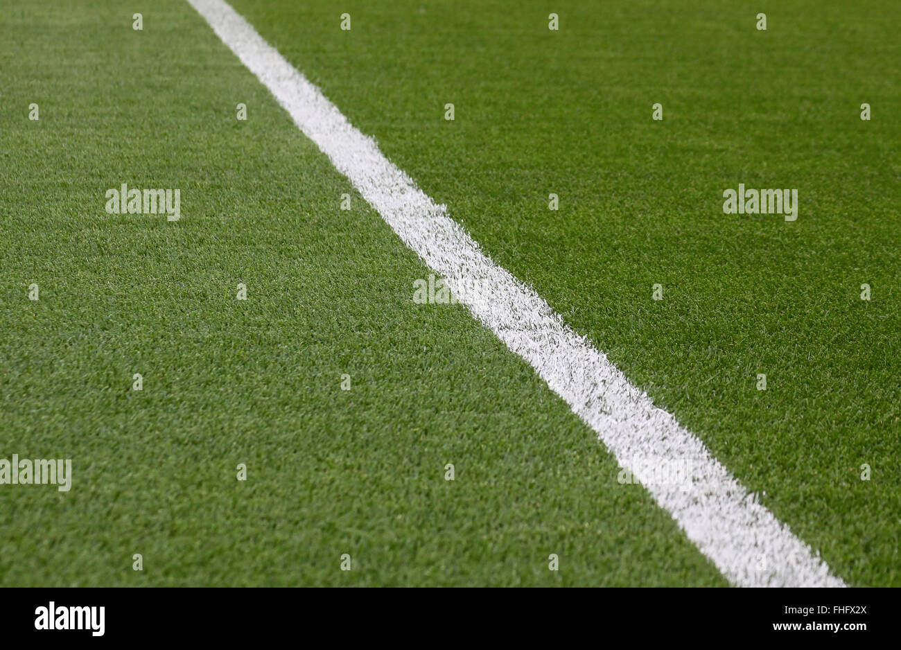 White stripe on the green soccer field Stock Photo - Alamy