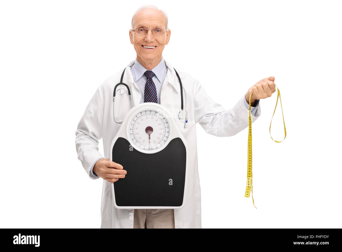 Mature doctor holding a weight scale and a measuring tape isolated on ...