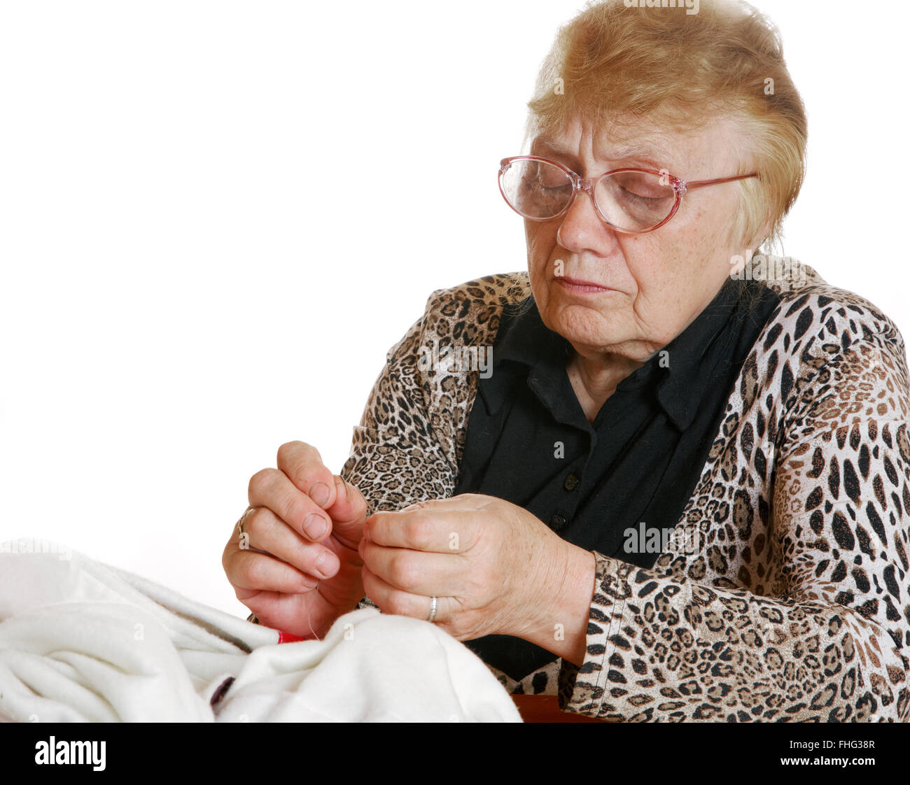 grandmother sewing needle and thread on white background Stock Photo ...