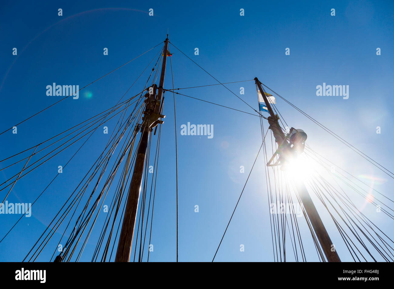 ship's mast, blue sky, sun and flags Stock Photo - Alamy