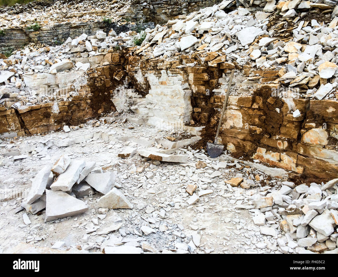 Small deserted surface stone quarry with a shovel Stock Photo - Alamy