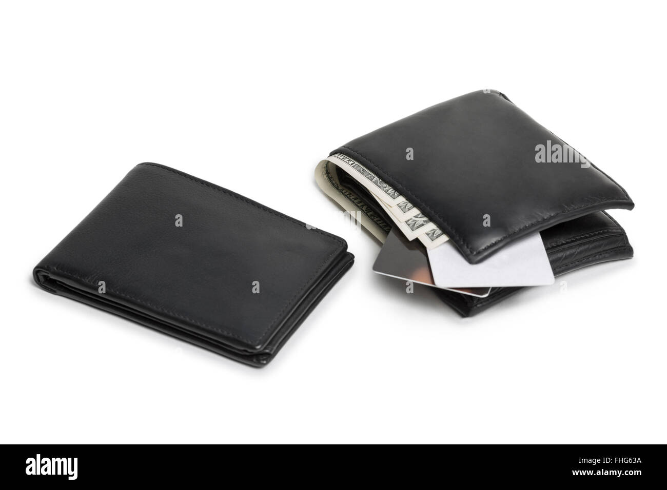 Small empty and a big full wallet with dollar notes and debit cards ...