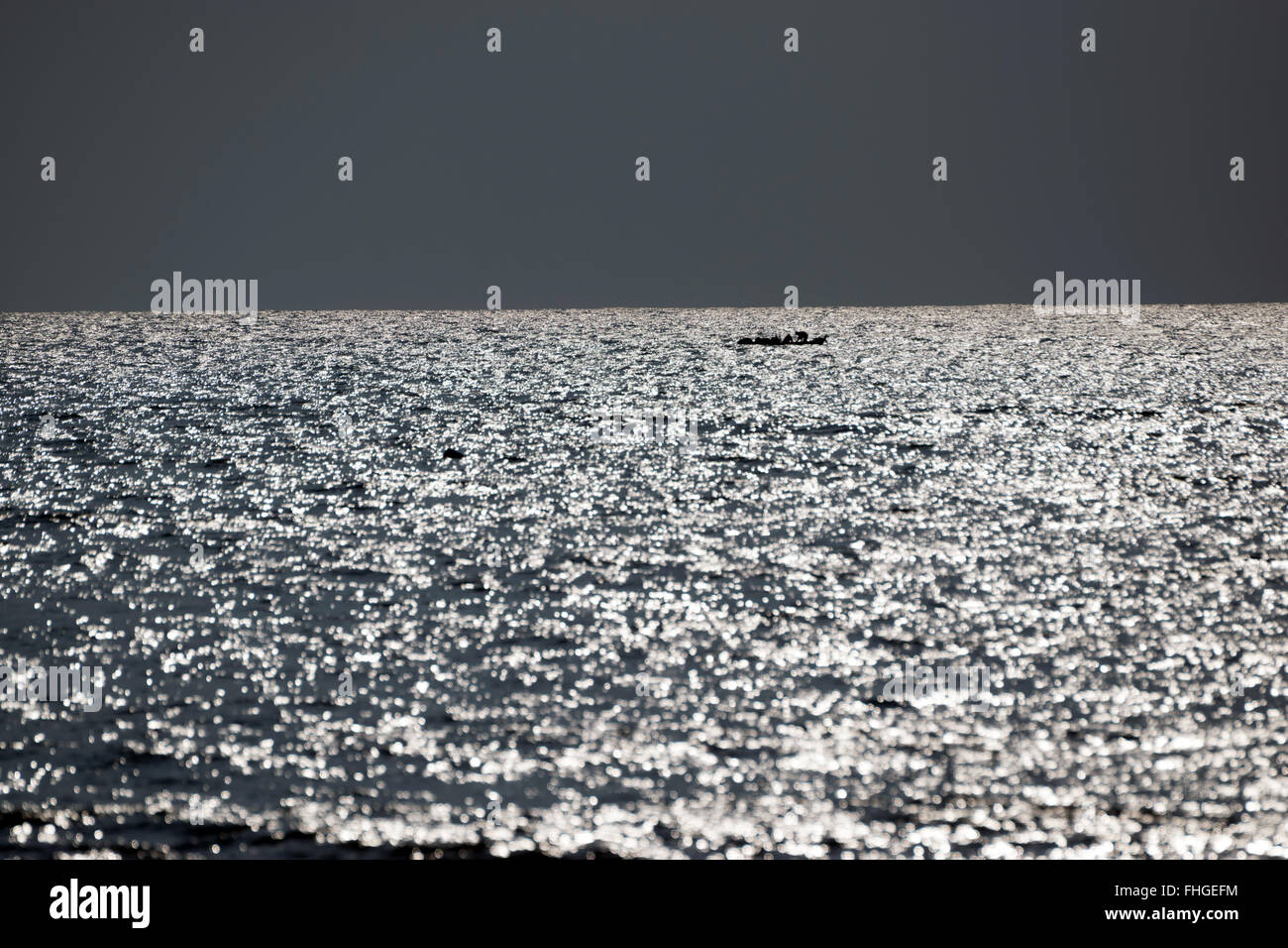 Fishing boat floating in the sea Stock Photo - Alamy