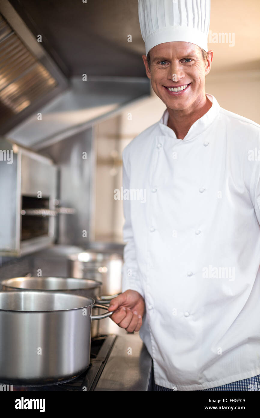 Happy chef smiling at camera Stock Photo - Alamy