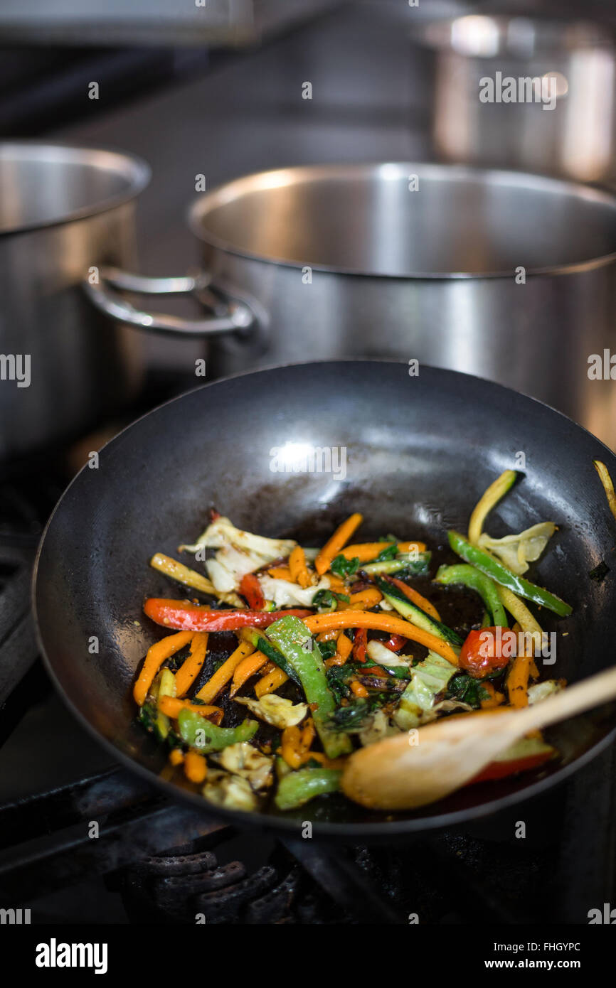 Chef making a stir fry Stock Photo - Alamy