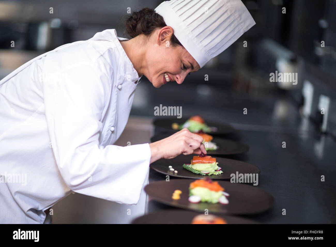 Chef preparing dishes hi-res stock photography and images - Alamy