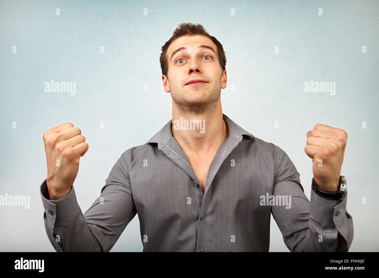 Happy winning man isolated on white Stock Photo - Alamy