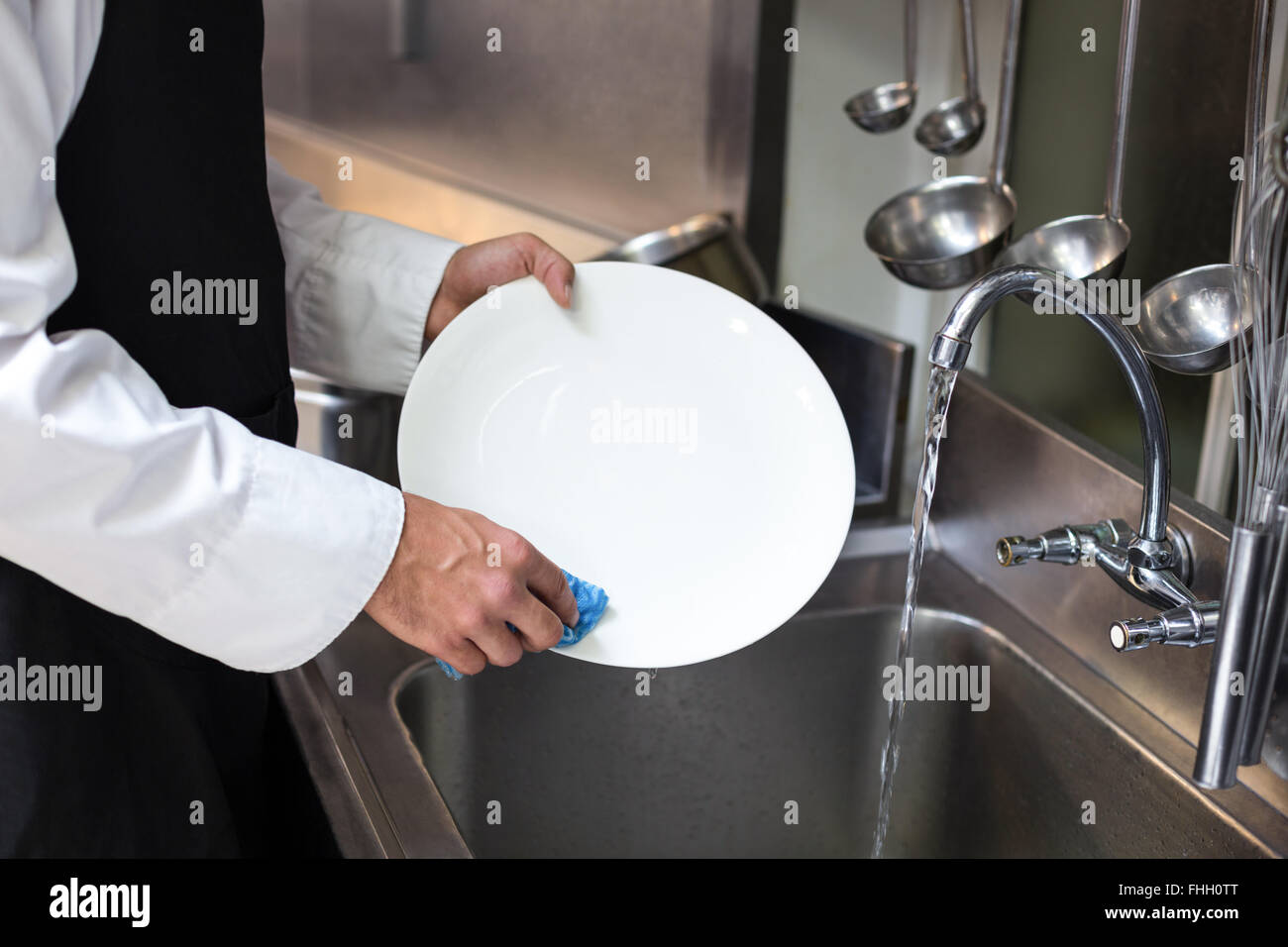 Chef washing a dish Stock Photo - Alamy
