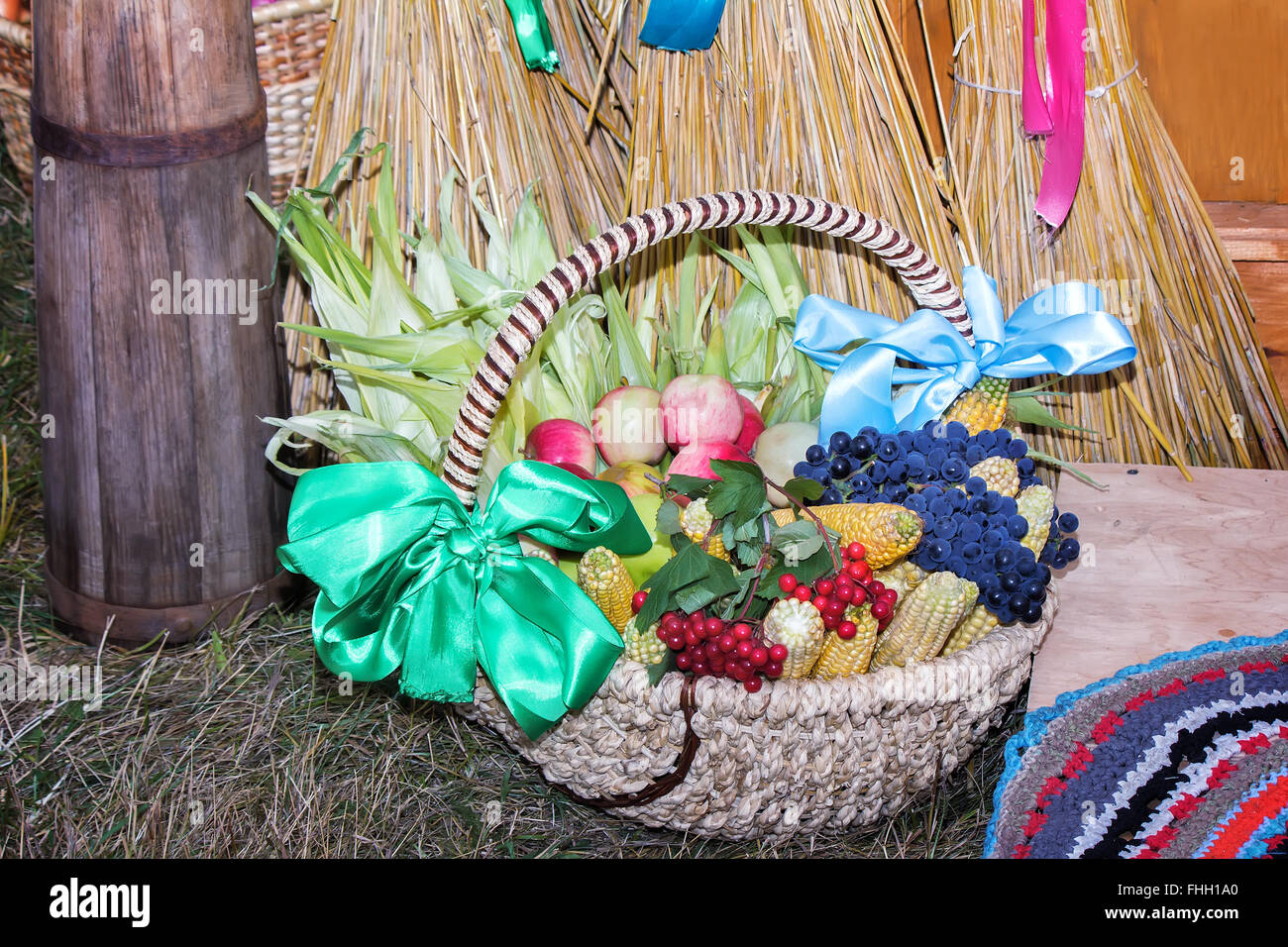 At the fair selling fruits and vegetables in a basket, decorated with ...