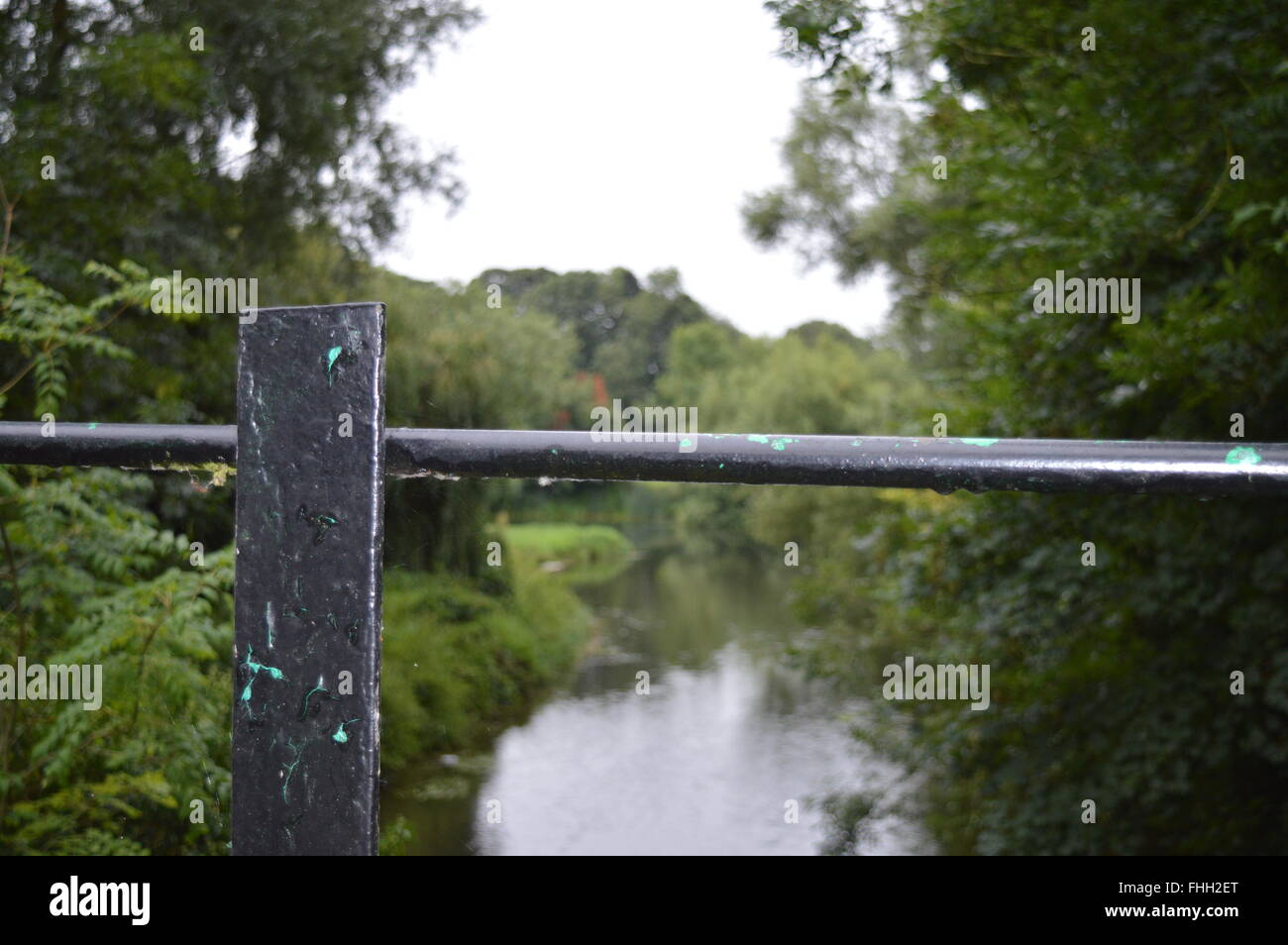 River through the railings Stock Photo - Alamy
