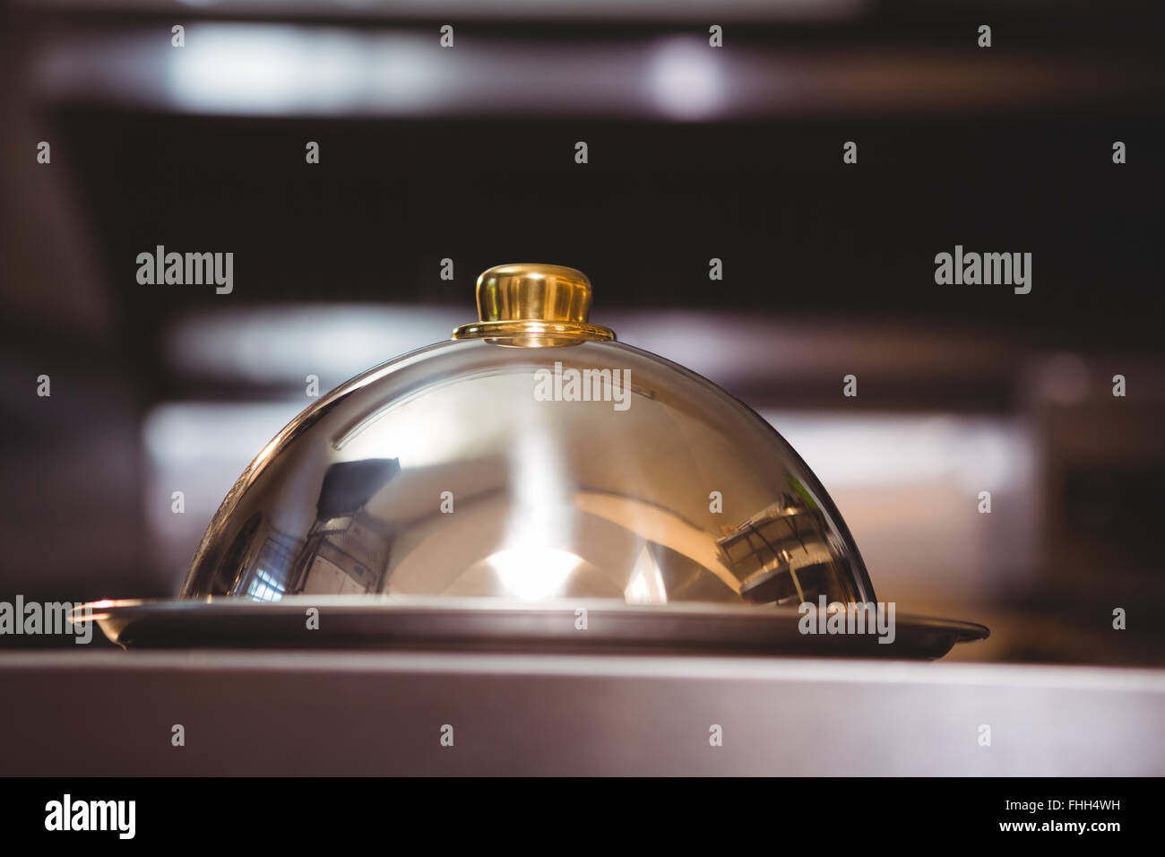 Chrome dish cover on counter Stock Photo - Alamy