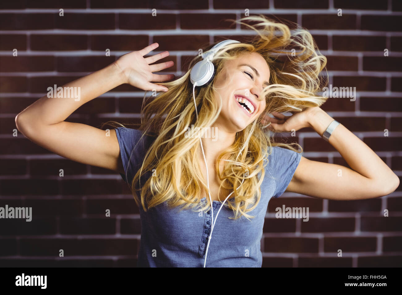 Woman listening to music and dancing Stock Photo - Alamy