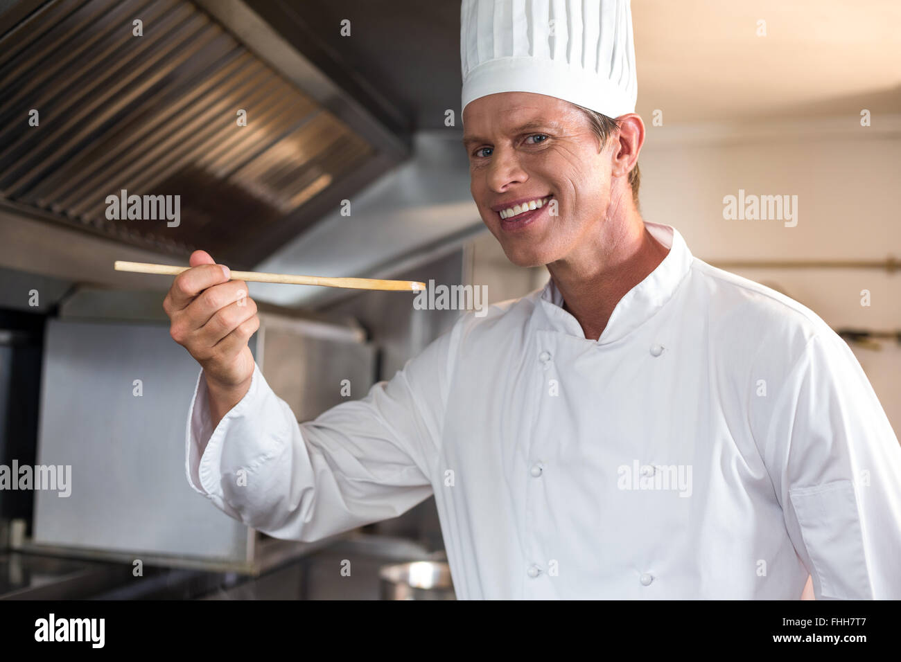 Happy chef smiling at camera Stock Photo - Alamy