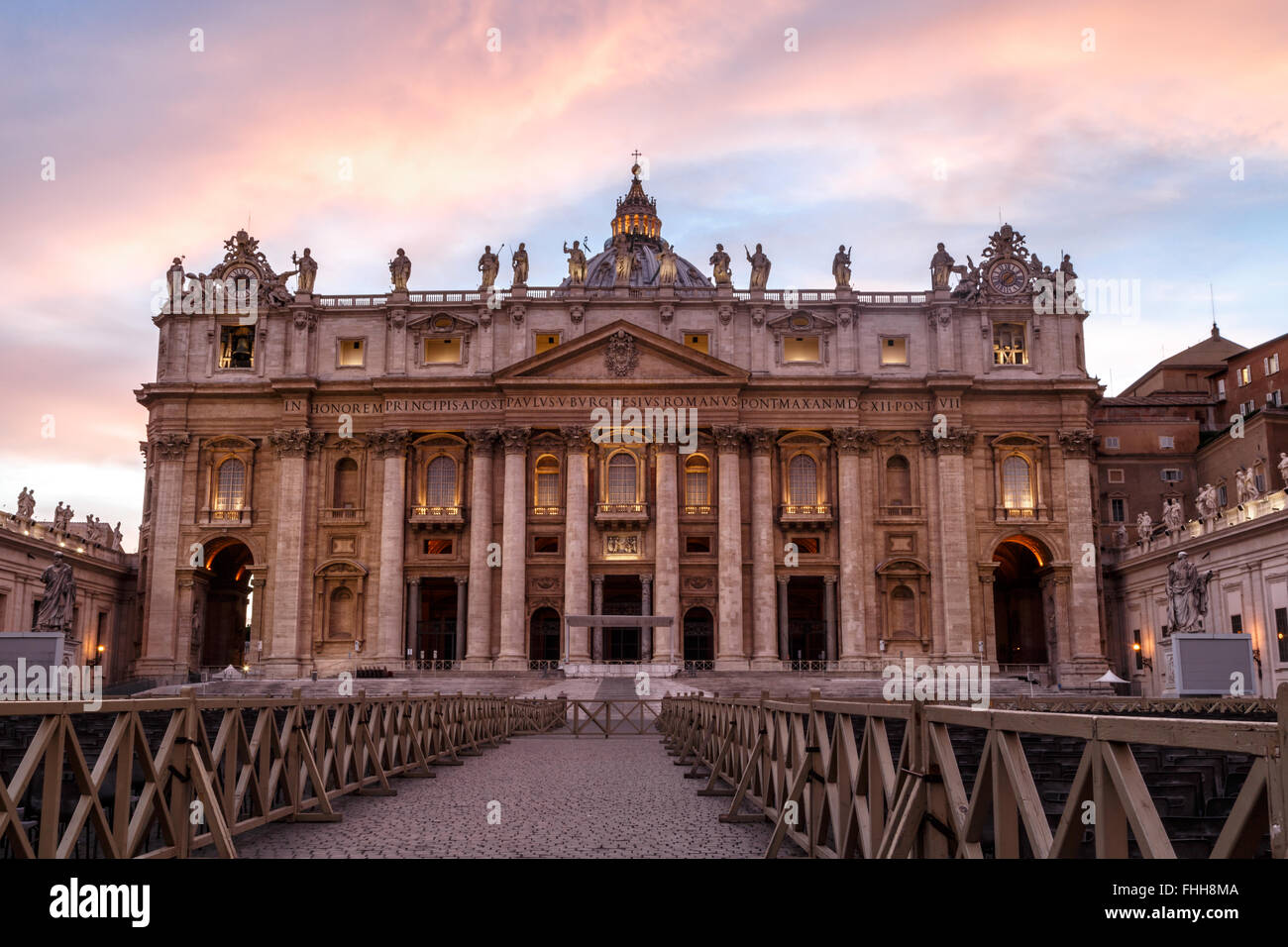 Front view of St Peter's Basilica in Vatican with people around, on ...