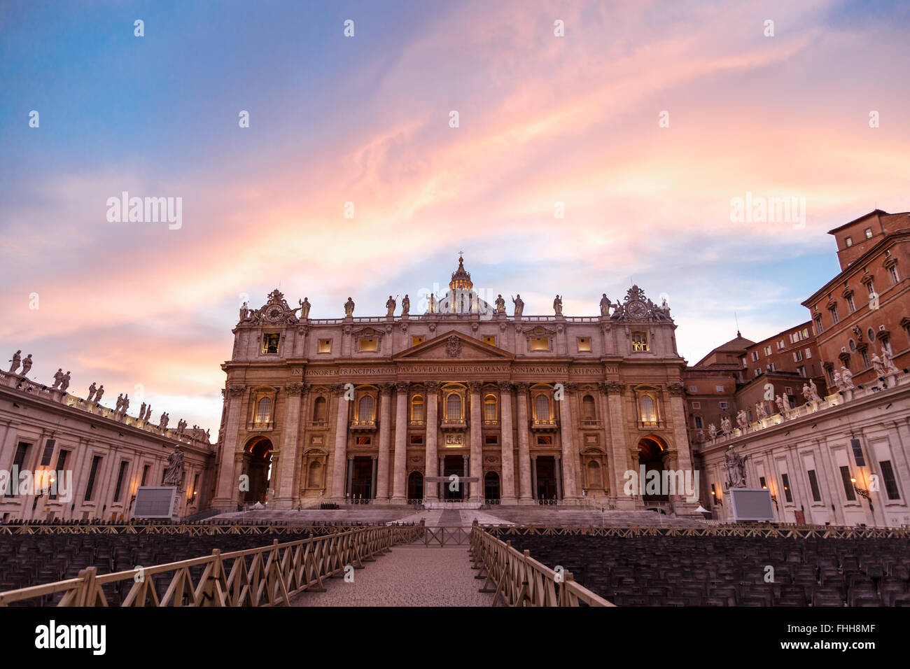 Front view of St Peter's Basilica in Vatican with people around, on ...