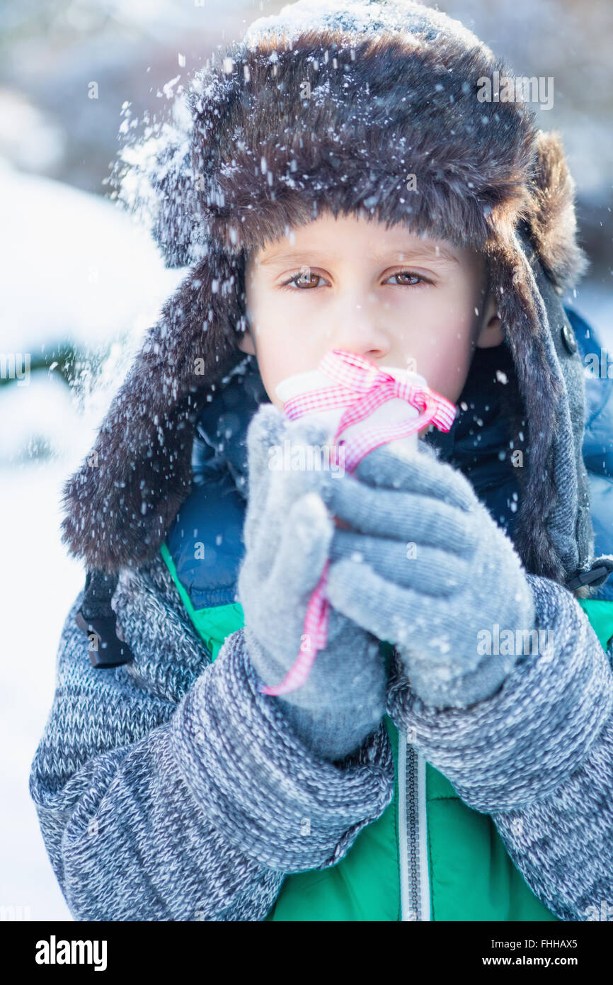 Cute boy drinking tea Stock Photo - Alamy