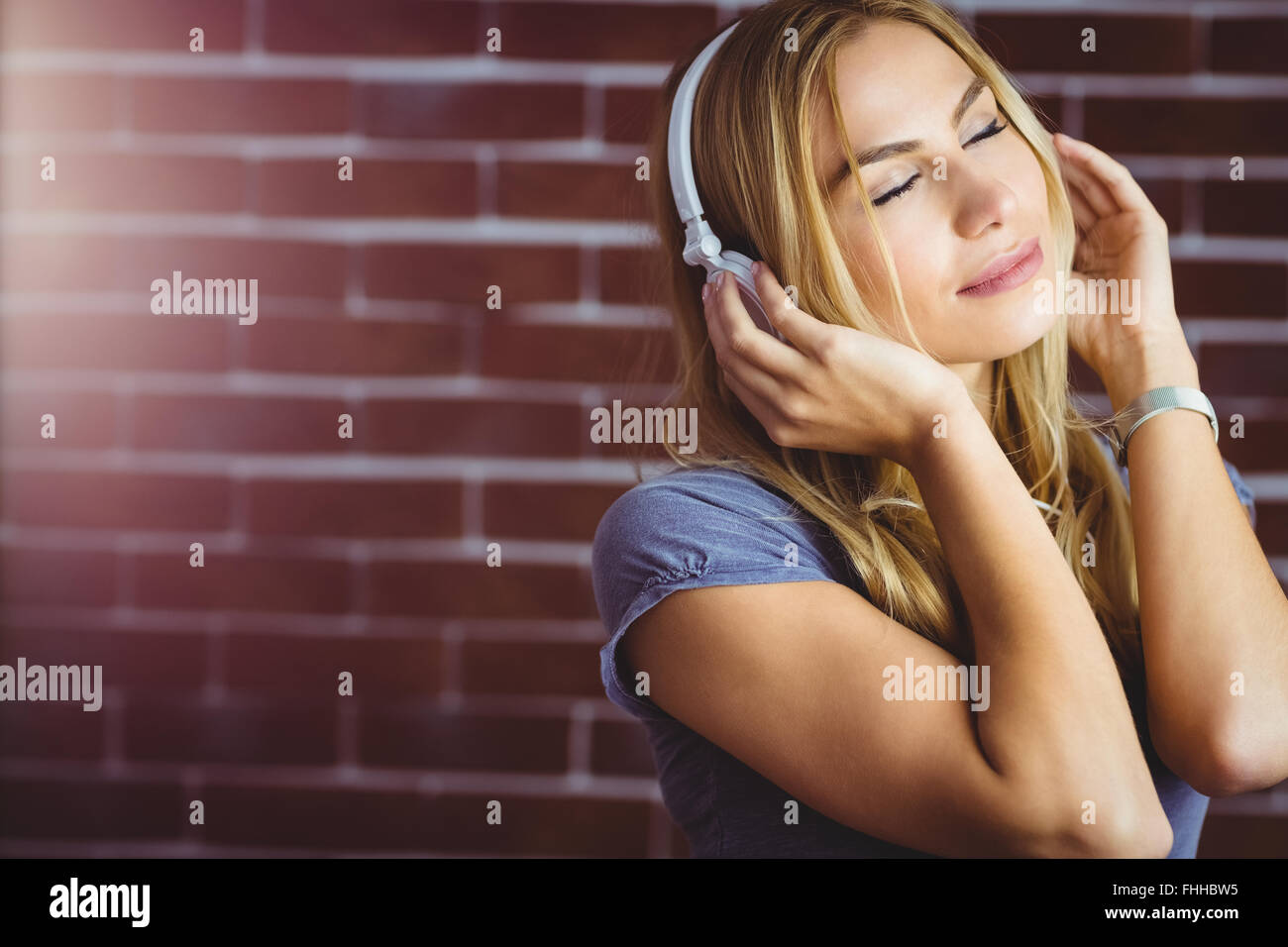 Woman listening to music Stock Photo - Alamy
