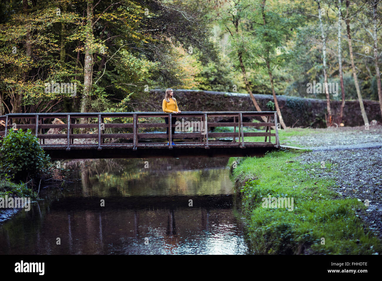Woman standing a bridge hi-res stock photography and images - Alamy