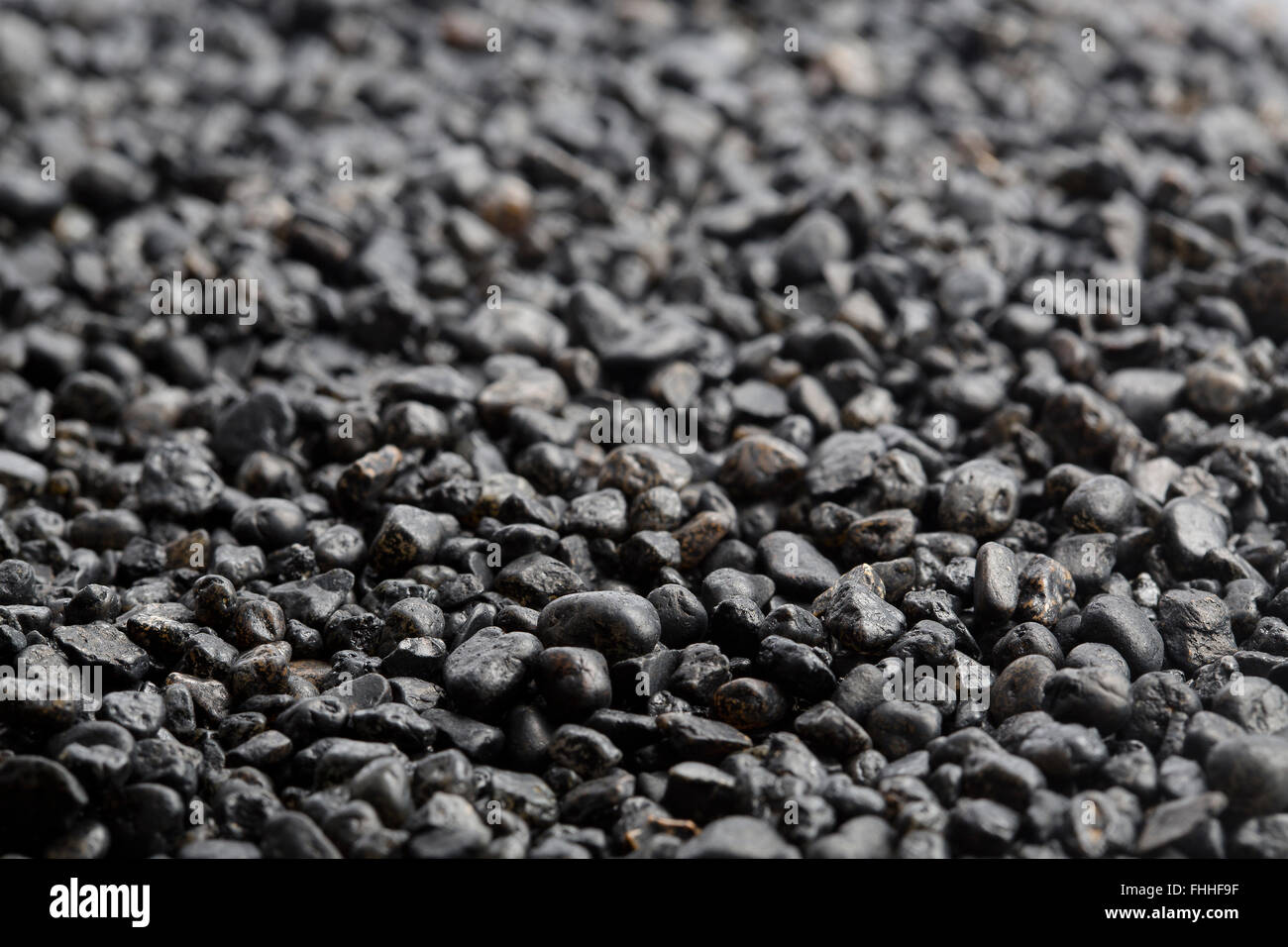 Closeup of dark stones for a background Stock Photo - Alamy