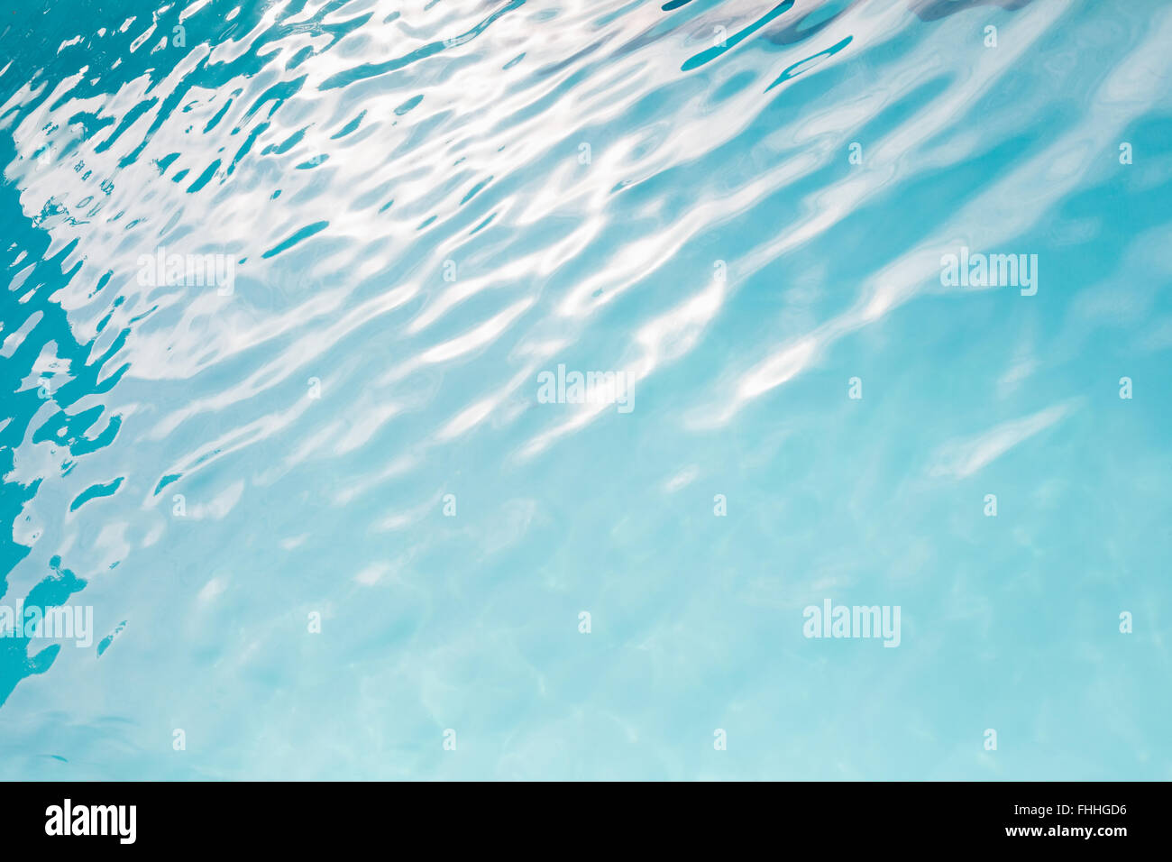 Ripples on blue swimming pool Stock Photo - Alamy