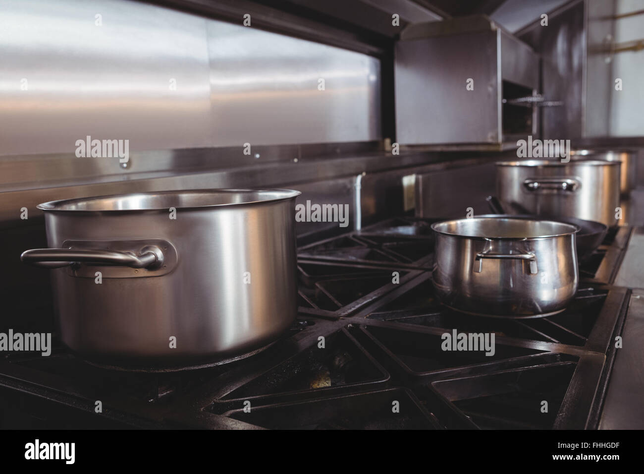 Pots and pans on stove top Stock Photo - Alamy