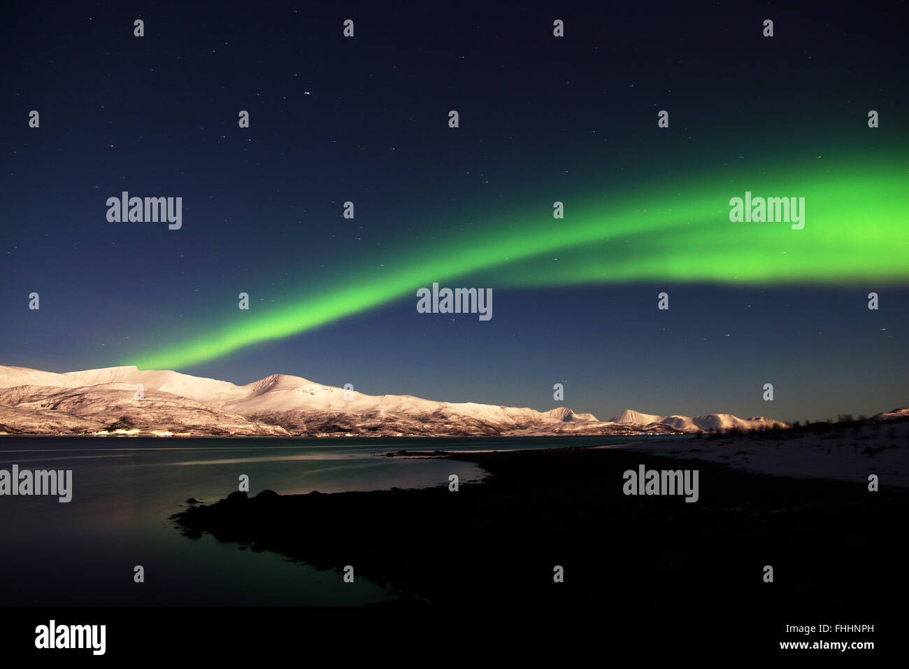 Northern lights over a fjord near Tromso, Norway Stock Photo - Alamy