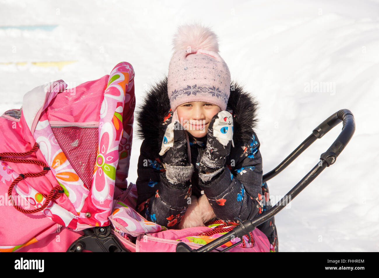 Little girl walking with the stroller Stock Photo - Alamy
