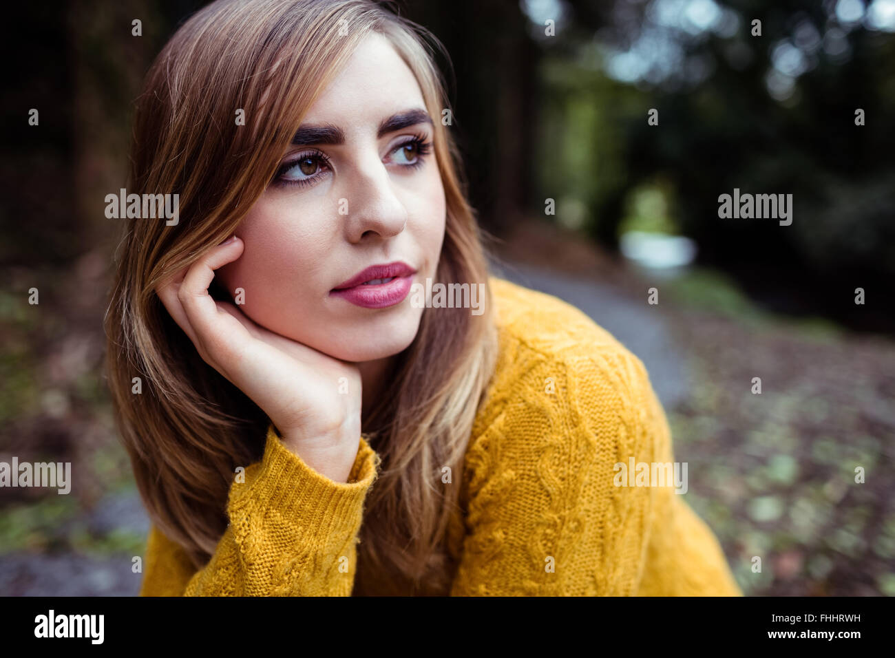 Leaning on the chin with both hands hi-res stock photography and images ...