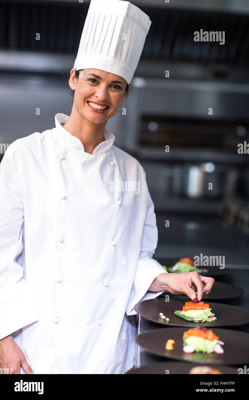 Happy chef with her dishes Stock Photo - Alamy