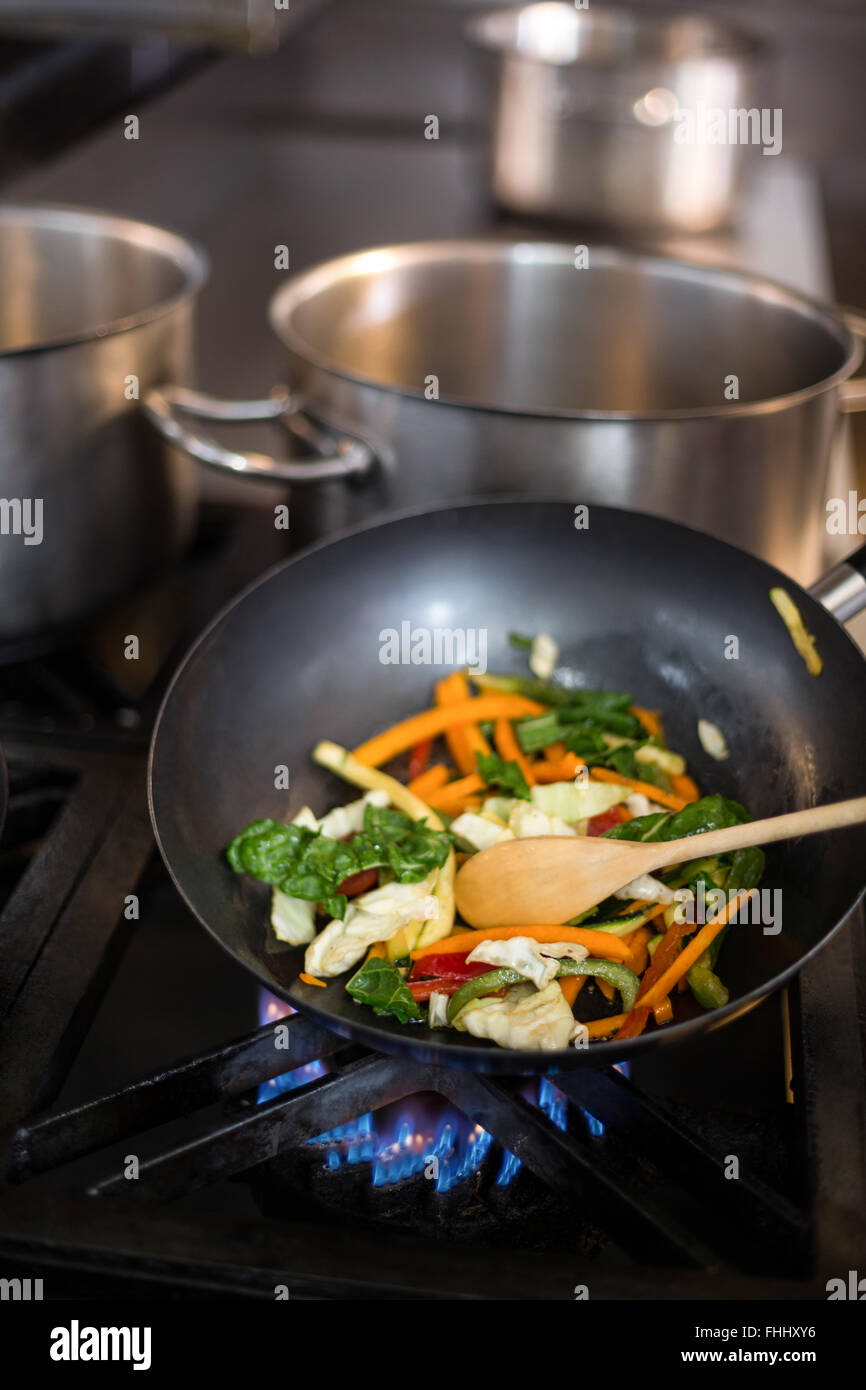 Chef making a stir fry Stock Photo - Alamy