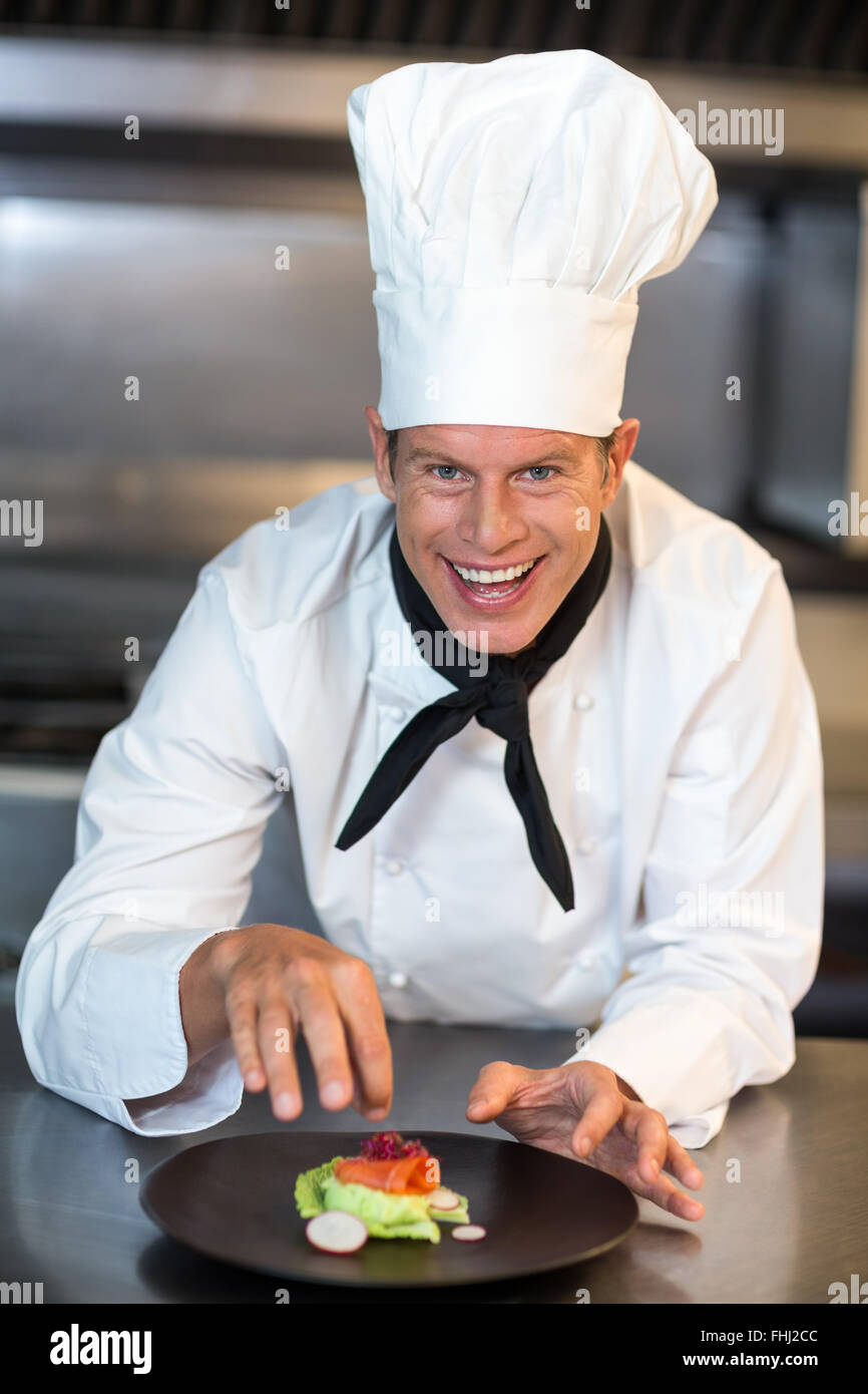 Happy chef showing his dish Stock Photo - Alamy