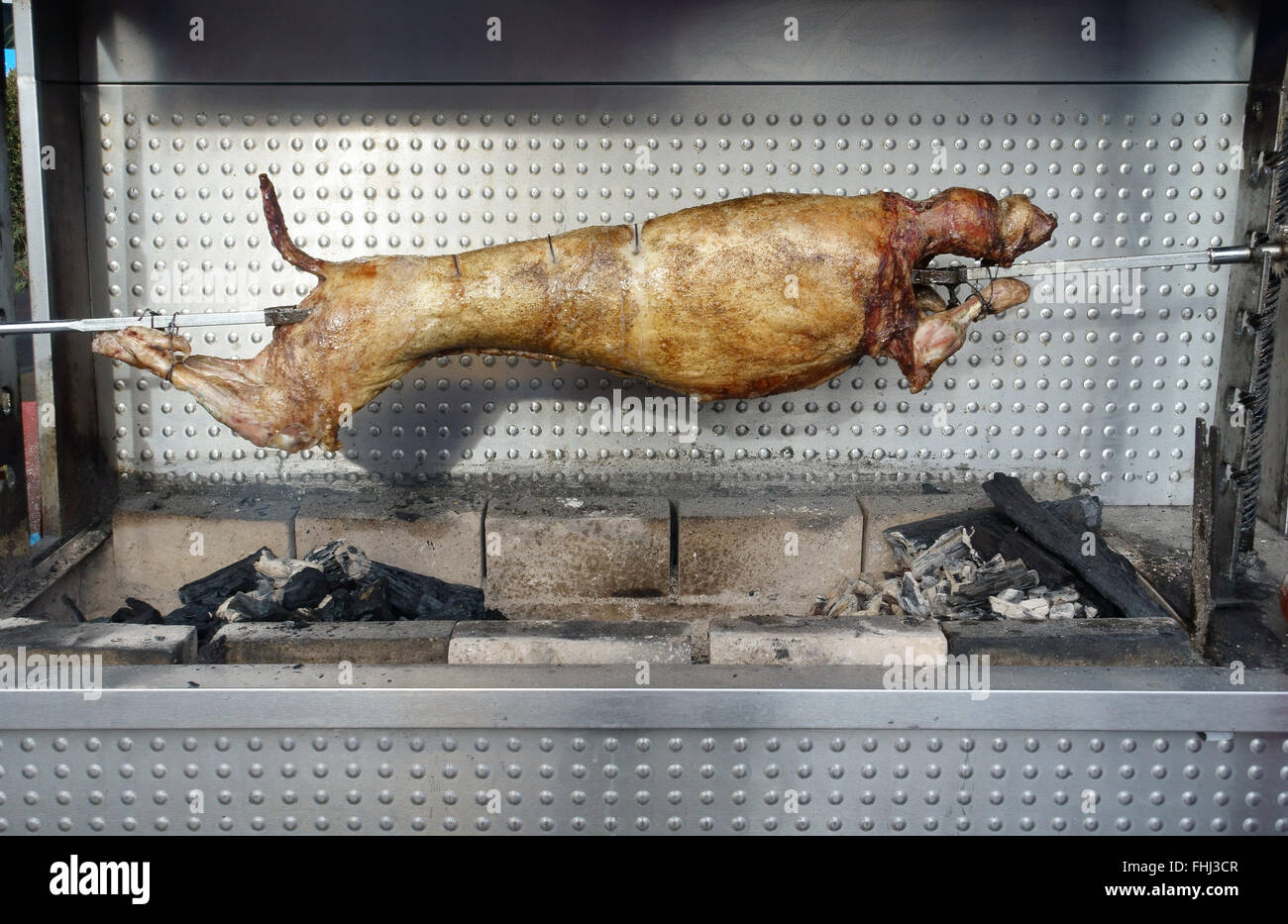 Meat being cooked outside a restaurant in Basko ski resort Bulgaria ...