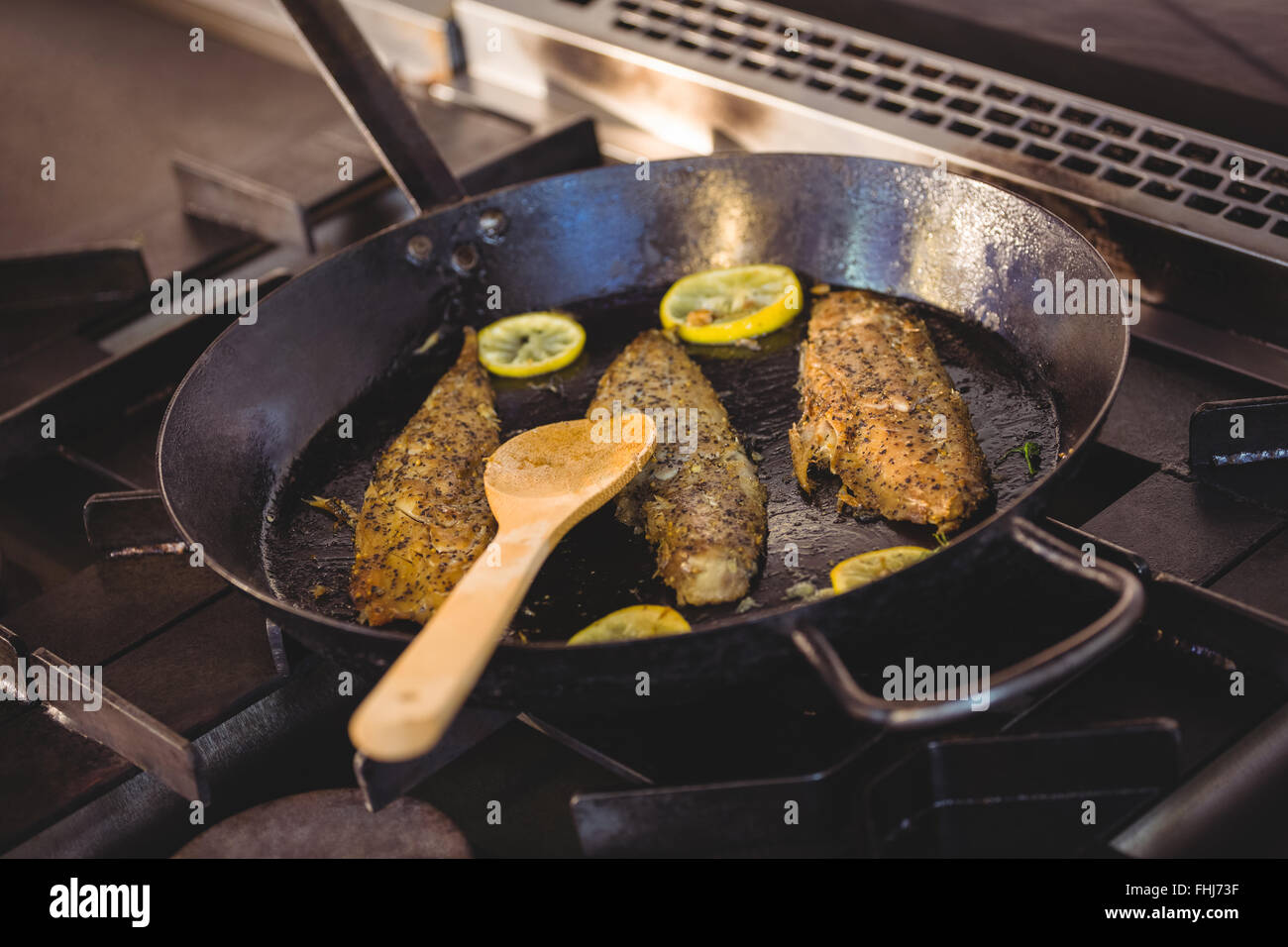 Pan frying fish hi-res stock photography and images - Alamy