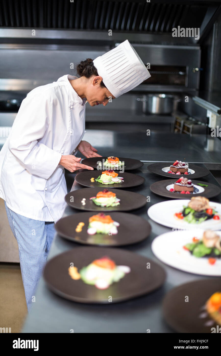 Happy chef with her dishes Stock Photo - Alamy