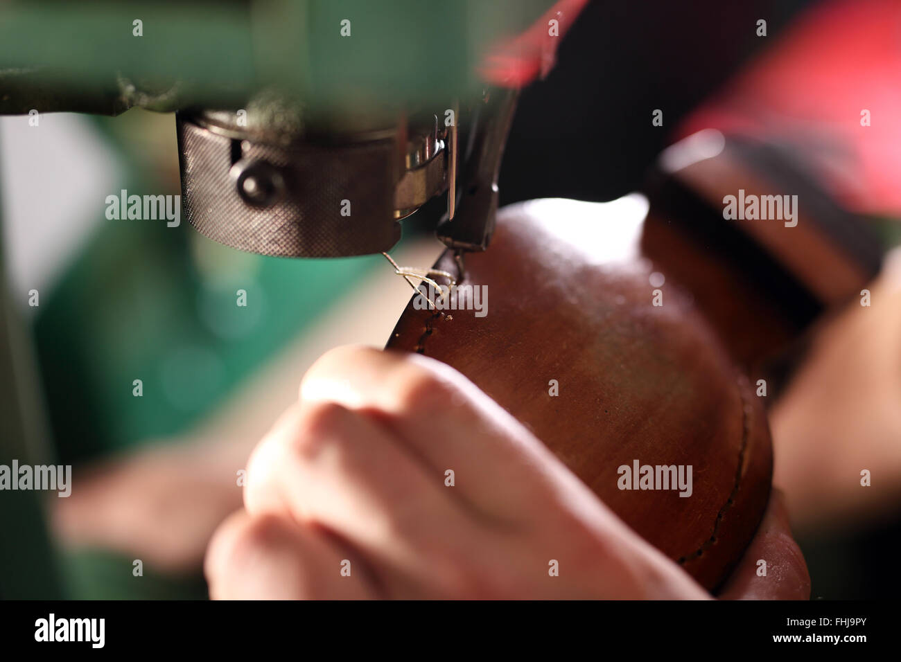 Elegant but masculine, manual precision work shoemaker. Sewing machine shoes. Sewing machines ...