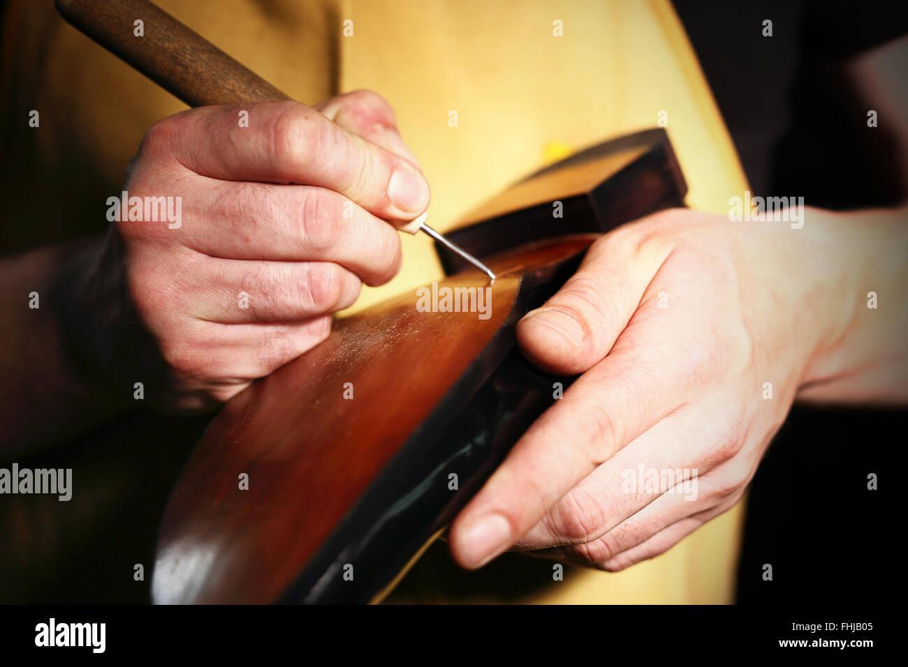 Laboratory shoemaker.Shear the edges of the skin. Hand thinning knife ...
